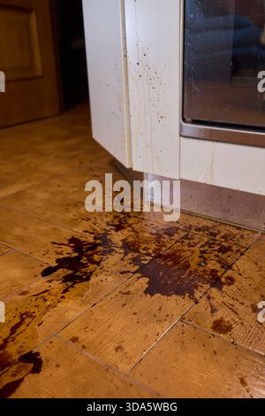 Cleaning a floor with a mop and spilled liquid Stock Photo - Alamy
