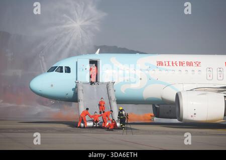 Passengers disembarked from a "distressed aircraft" slide during the ...
