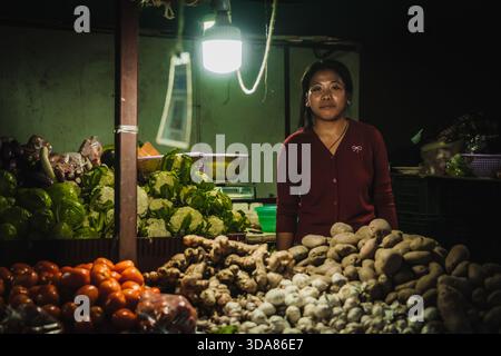 Woman standing behind a light bulb Stock Photo - Alamy