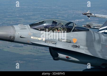 Panel of jet cockpit instruments highlighting an altimeter within an ...