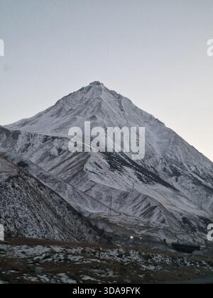 Peaceful landscape with snowy mountain slopes at sunset, Iceland Stock ...