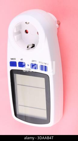 Digital Power Meter on pink background Stock Photo - Alamy