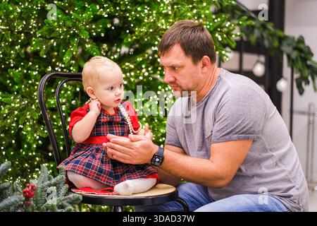 happy father and baby girl decorate christmas tree Stock Photo - Alamy