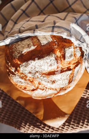 Golden brown crust with flour dusting on textured white surface. Soft ...