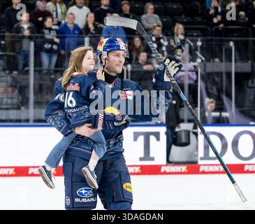 Conrad Abeltshauser (EHC Red Bull Muenchen, #16) sitting on the bench ...