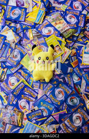 Valencia, Spain - December 10, 2025: Pokemon doll on a game cards with ...