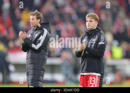 December 13, 2025, Berlin, Berlin, Germany: A police officer walks past ...