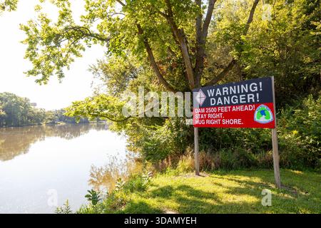 A warning sign ahead of a spillway and dam Stock Photo - Alamy