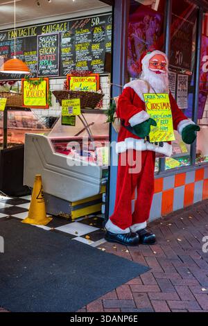 A life-size mannequin of Santa Claus for sale at the Christmas market ...