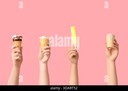 Female hands with different sweet ice-cream in waffle cones on red ...