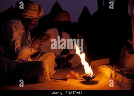 Bhil indigenous men praying, Barjarsar, Rajasthan Desert, India Stock ...