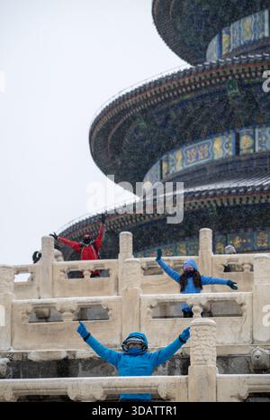 Tourists visit the Tiantan Park amid hot weather in Beijing, China ...