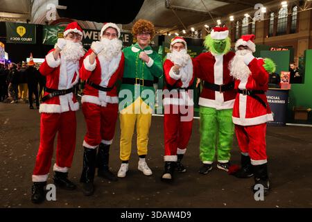 Fans in fancy dress pose for photographs on day fifteen of the Paddy ...