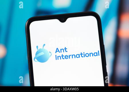 In this photo illustration, an Ant International logo is seen displayed ...