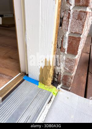Applying Wood Filler to Door Frame Corner Stock Photo - Alamy