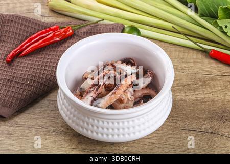 Grilled octopus red tentacle sliced appetizer Stock Photo - Alamy