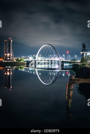 Modern arc bridge over the river, day traffic, summer time. modern ...