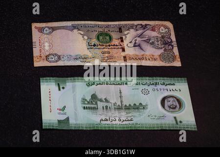 UAE dirham banknotes on dark background, showing Sheikh Zayed portrait ...