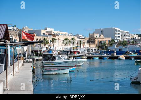 Summer atmosphere in the coastal village of Marsaxlokk with colorful ...