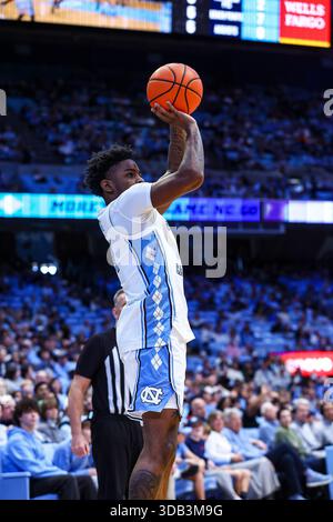 December 13, 2025: North Carolina center Henri Veesaar (13) dunks ball ...