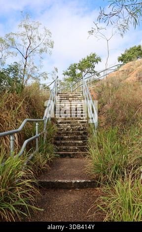Concrete outdoor staircase on a slope in the middle of residences at ...