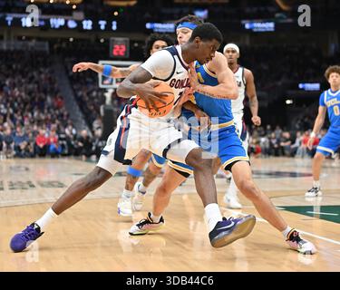Gonzaga guard Tyon Grant-Foster, right, blocks a shot by Loyola ...