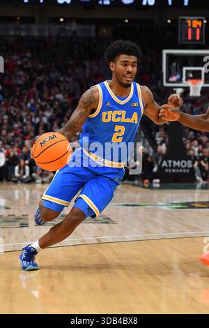 UCLA guard Donovan Dent (2) drives to the basket to score a game ...