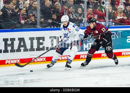 Koeln, Germany. 14th Jan, 2026. Cenk Özkacar (KOE, L) geht mit ...