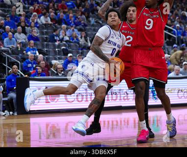 Rutgers' Lino Mark goes up for a layup as Illinois' Jake Davis defends ...
