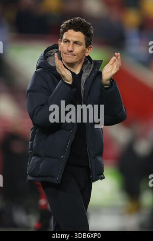Brentford manager Keith Andrews applauds the fans after the Premier ...