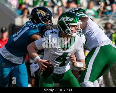 New York Jets quarterback Brady Cook warms up before an NFL football ...