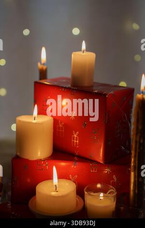 Cozy evening scene with candles, white wine glasses and warm candle ...