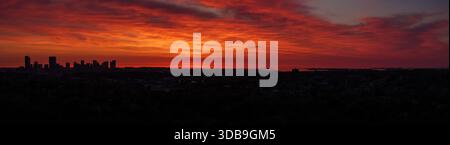 A scenic shot of fiery sunset above the clouds in Meersburg, Germany ...