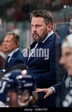 Finland head coach Antti Pennanen, right, hugs Mikko Lehtonen (4) after ...