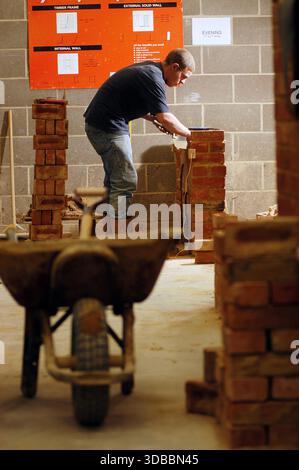 Apprentice bricklayers learning their trade Stock Photo - Alamy