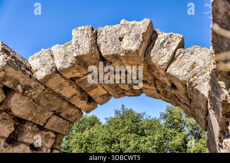Arched entrance to the ancient stadium track at the Archaeological Site ...