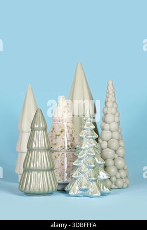 Beautiful ceramic Christmas trees on color background Stock Photo - Alamy