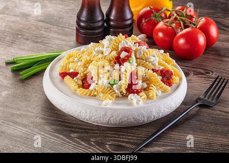 Italian pasta fusili with curd and dry tomato Stock Photo - Alamy