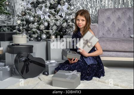 Teenager child with gift box, studio isolated background. Present for ...