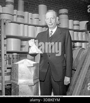 A photograph from the late 1940s-1950s showing a man posing with ...
