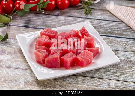 Raw tuna fish cubes heap for poke Stock Photo - Alamy