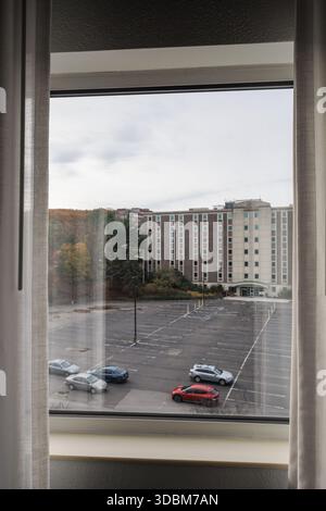 View from the window to the parking lot near the residential building ...