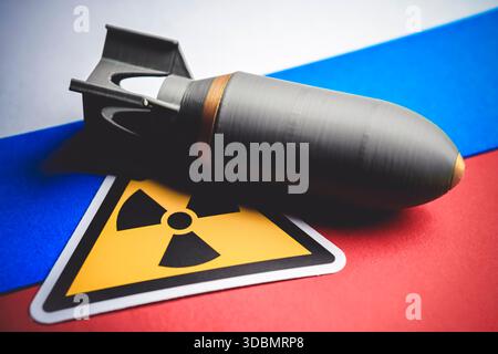 Flag of Russia and bomb with radioactivity sign, nuclear threat Stock ...