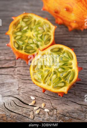 African horned cucumber on the wooden table Stock Photo - Alamy