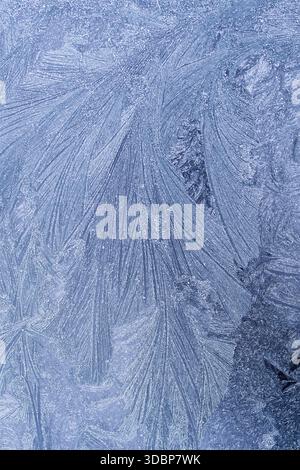 winter icy patterns - Picture of frost on the glass at sunset Stock ...