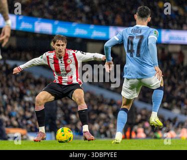 Phil Foden of Manchester City under pressure from Nikola Milenkovic of ...