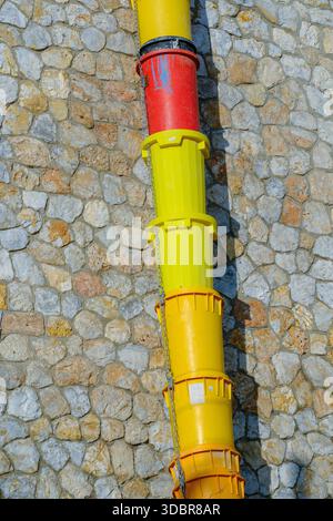 Construction waste removal into a skip container using long funnel ...