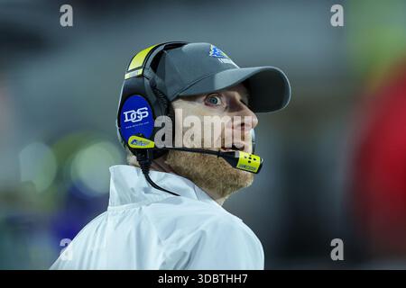 Delaware head coach Ryan Carty, left, is interviewed after an NCAA ...