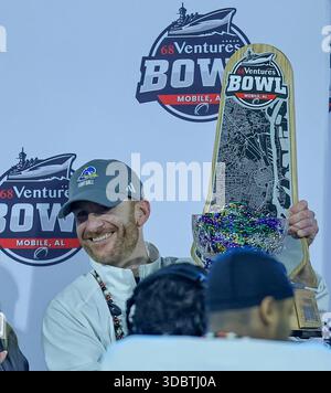 Delaware head coach Ryan Carty, left, is interviewed after an NCAA ...