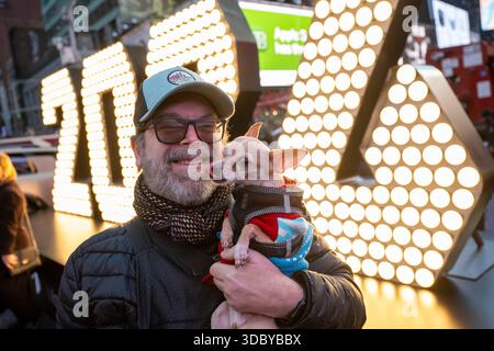 Joe Simon and his dog Gladys pose with he Times Square New Year's Eve ...